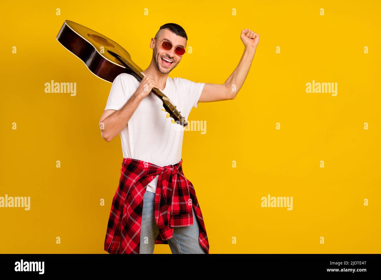 Photo portrait man wearing sunglass playing guitar gesturing like ...