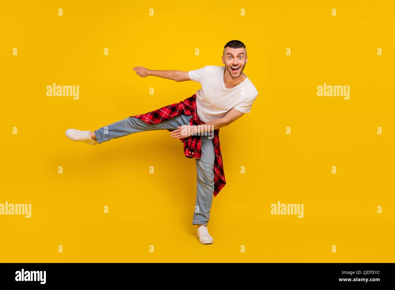Full length photo of cheerful amazed man wear checkered shirt on waist ...