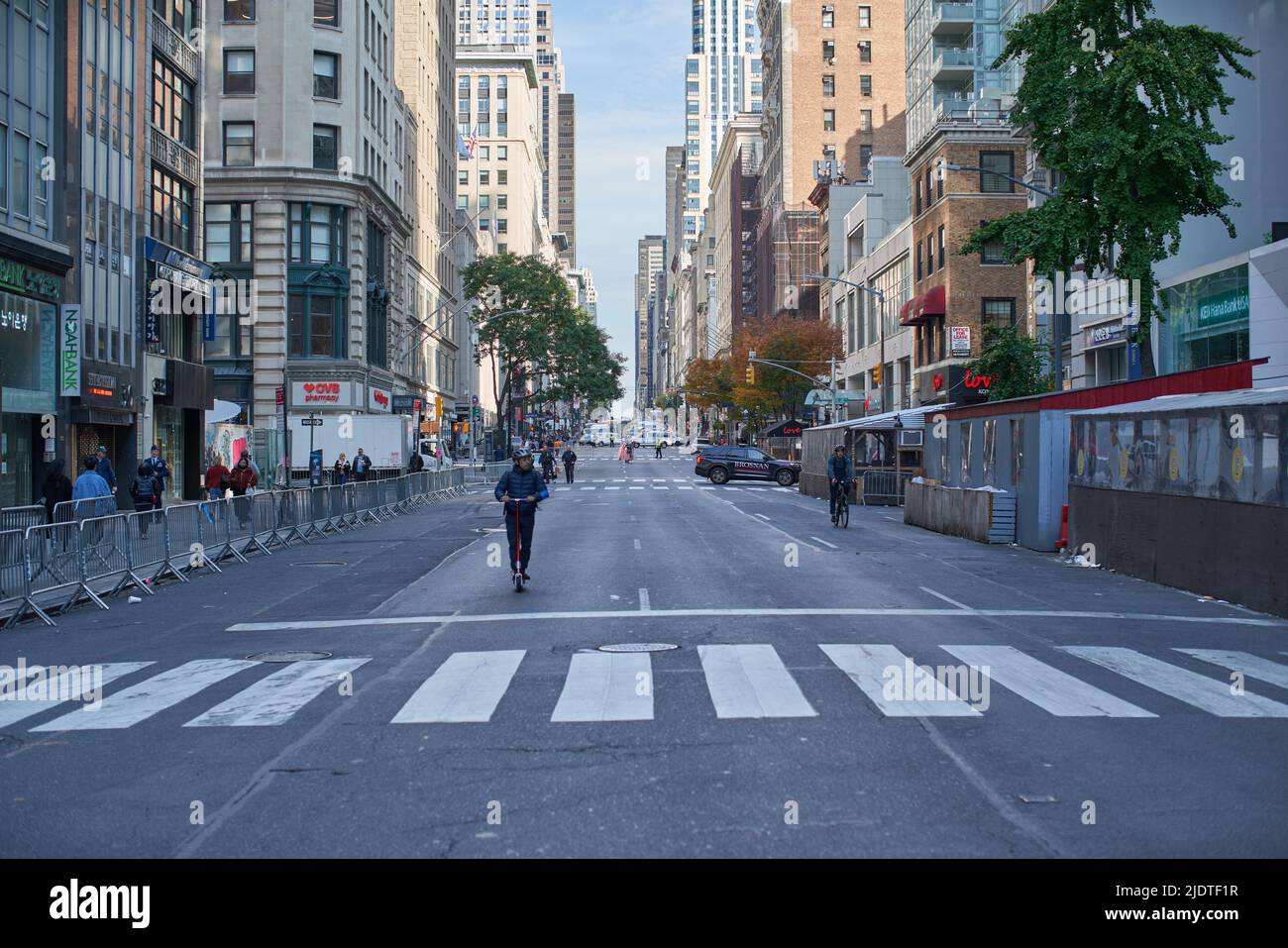 Manhattan, USA - 11. November 2021: Men on electric scooter in NYC ...