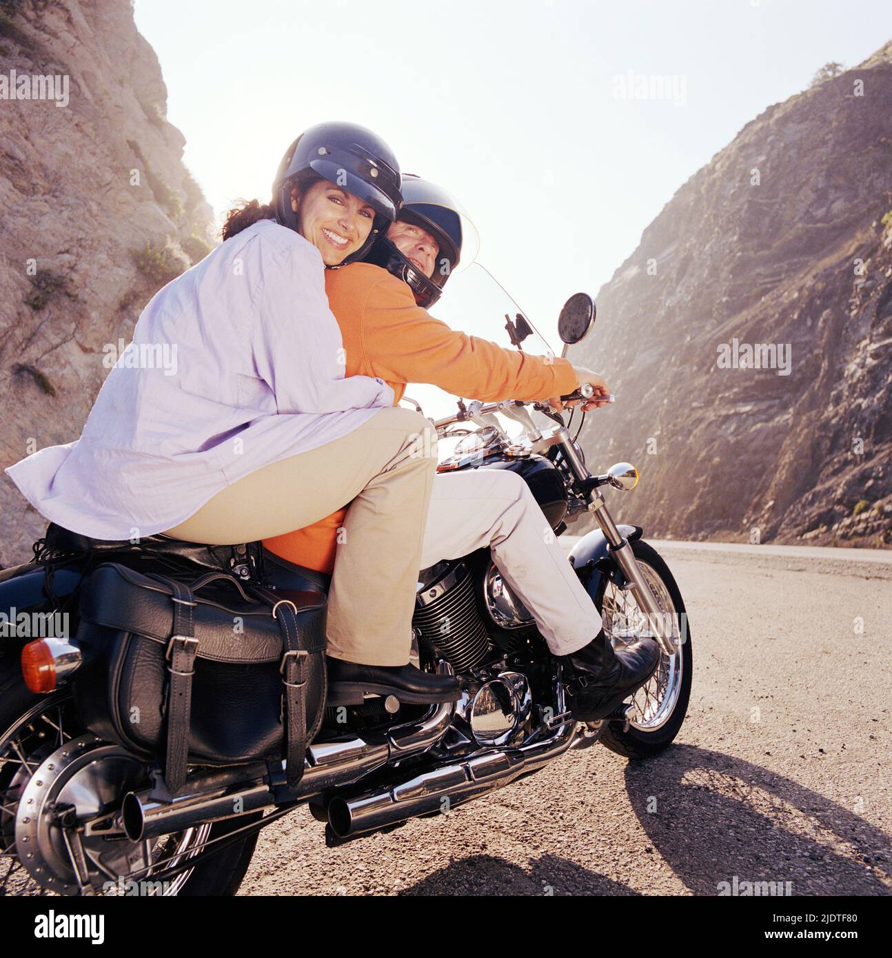 Couple riding motorcycle Stock Photo - Alamy