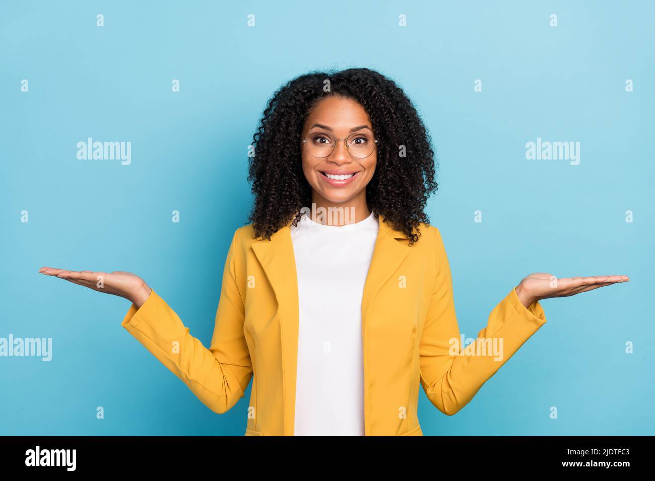 Photo of young black woman happy positive smile hold hands product ...