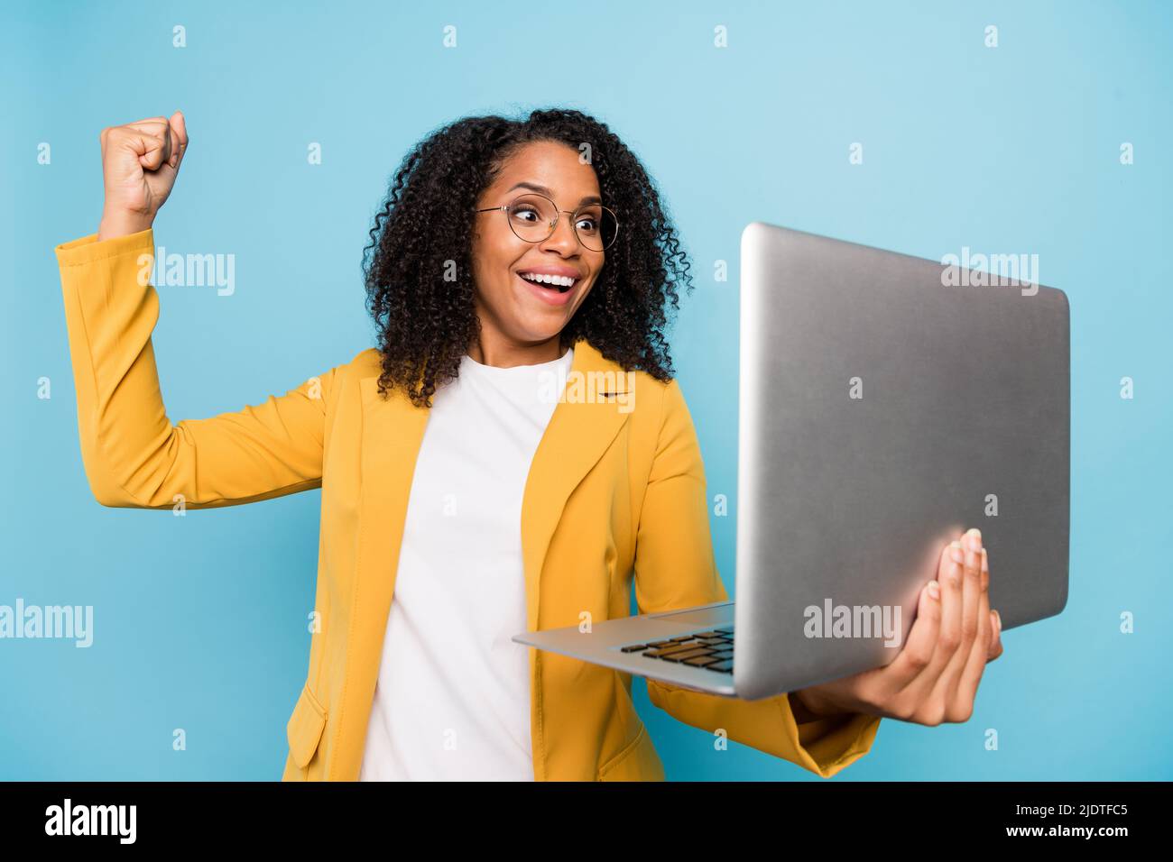 Photo of young afro woman happy positive smile celebrate success look ...