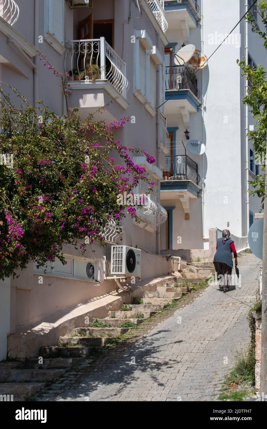 Typical street in the city center of Kas, Turkey. White buildings and ...
