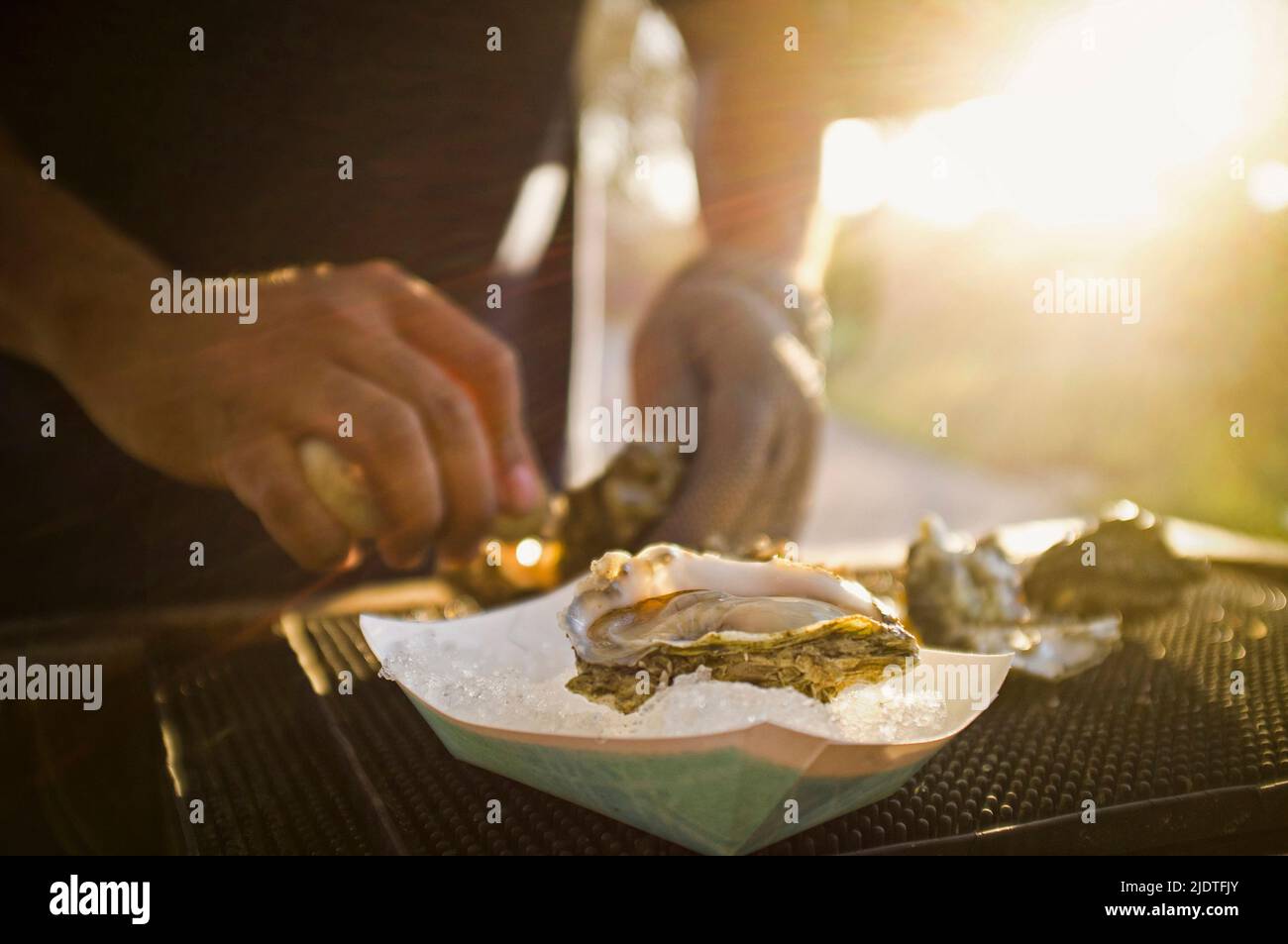 Shucking hi-res stock photography and images - Alamy