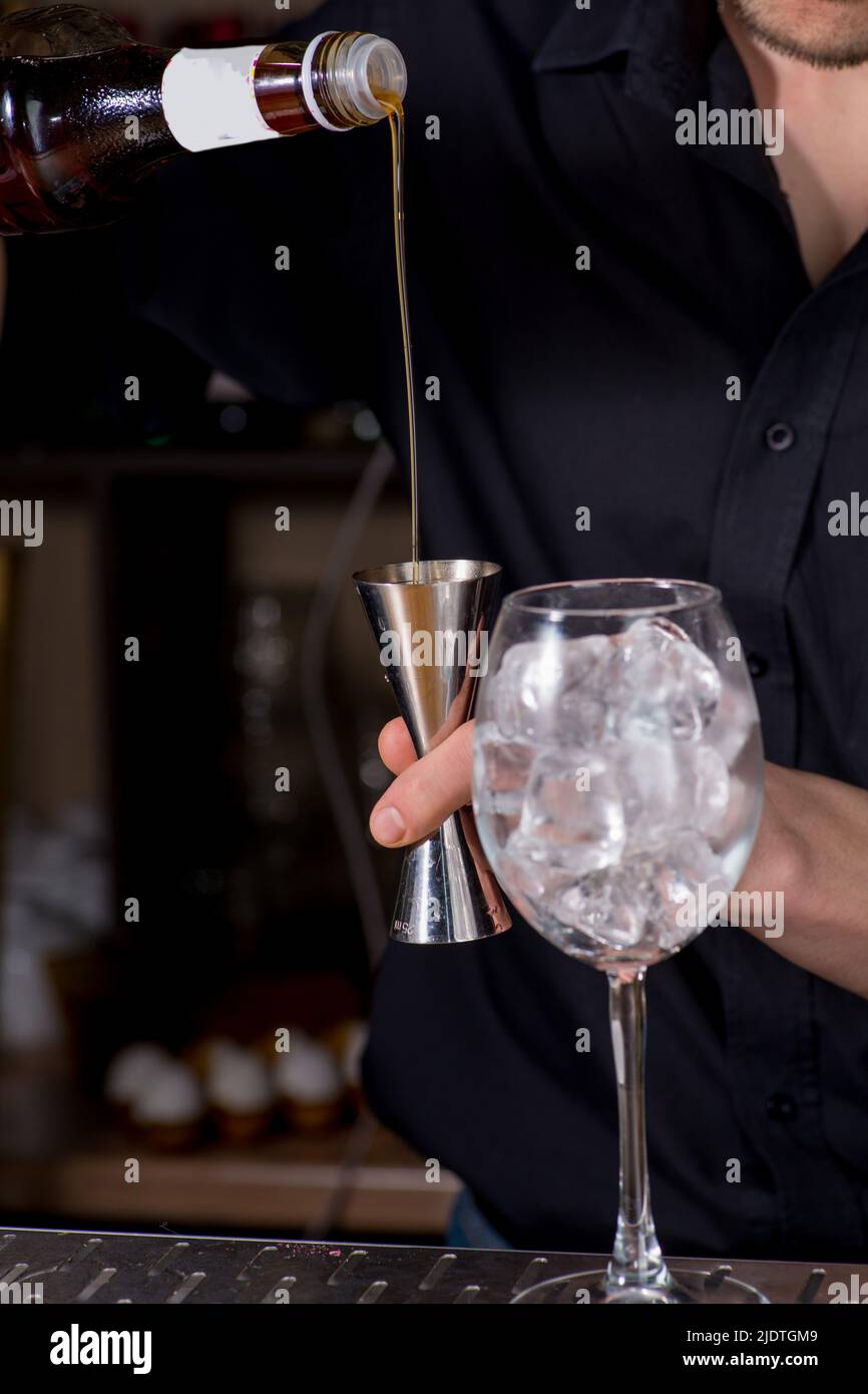 Bartender pours drink hi-res stock photography and images - Alamy