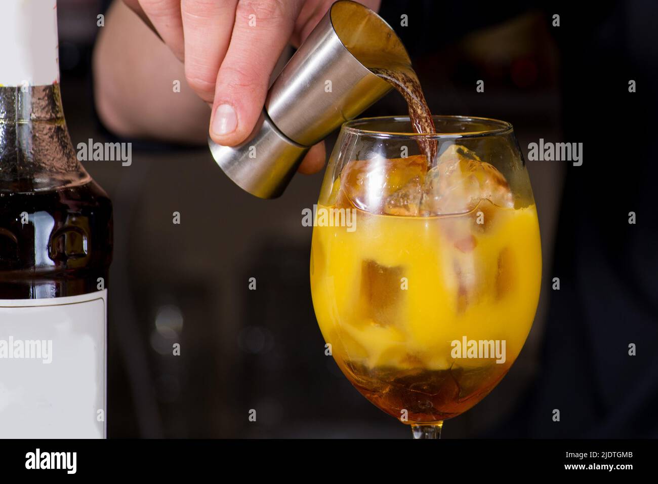 Bartender pours drink hi-res stock photography and images - Alamy
