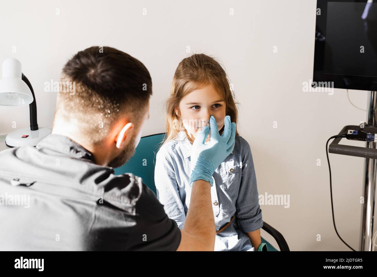Nose examination of the child. Consultation of kid with a pediatric ...