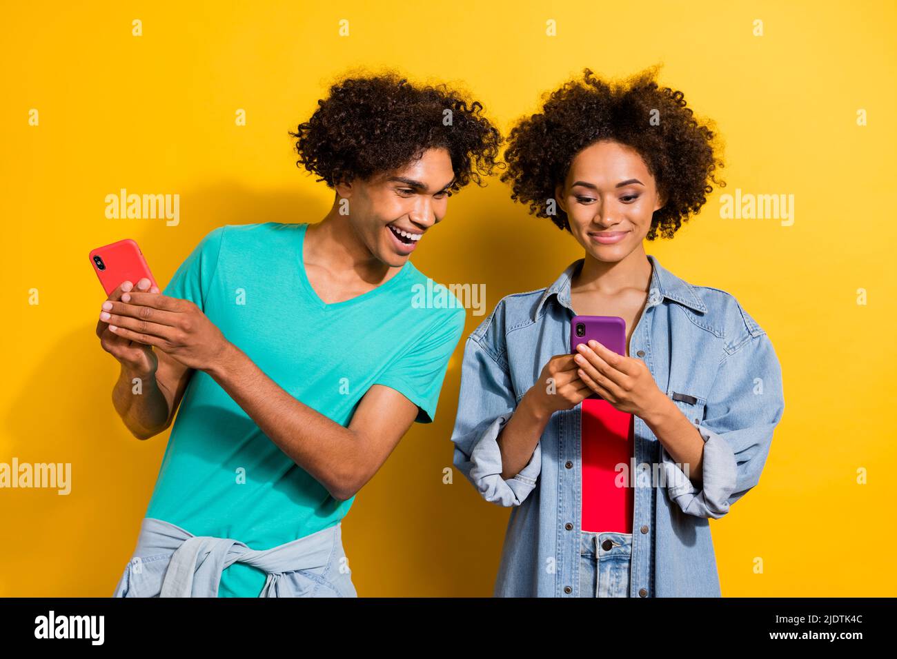 Photo of happy young dark skin couple hold hands phone write comment ...