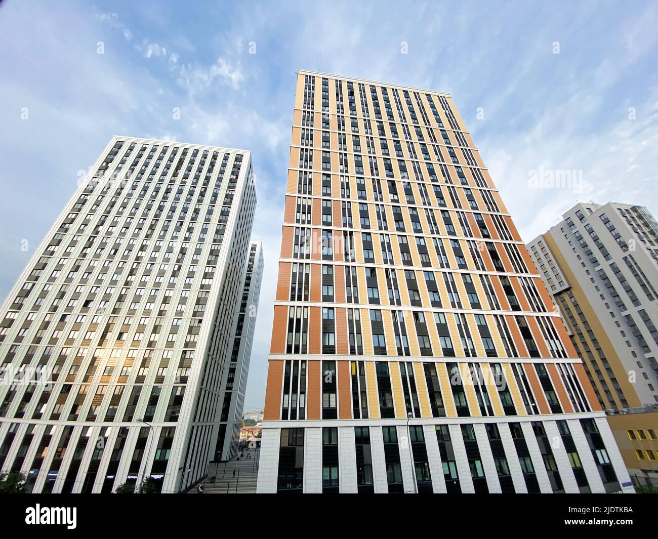 New multi-storey apartment block houses. Mortgage concept. Tall as ...