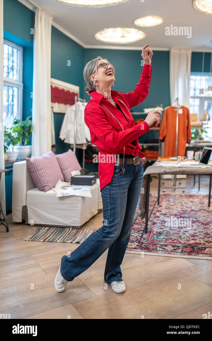 Happy woman in glasses dancing hi-res stock photography and images - Alamy