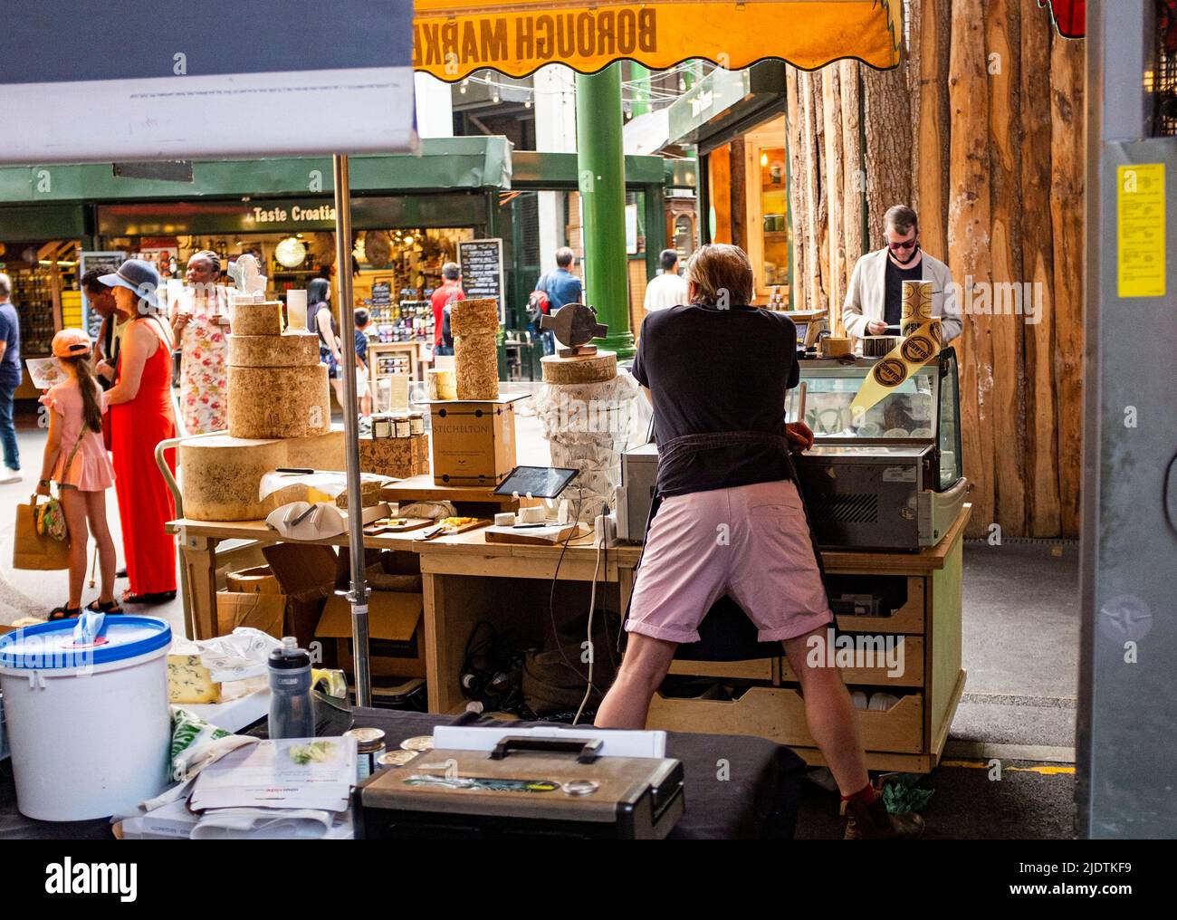 London , England UK - Cheese seller at Borough Market stall Stock Photo ... London , England UK - Cheese seller at Borough Market stall Stock Photo ...
