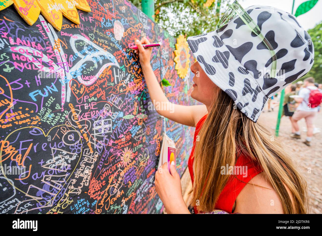 Glastonbury, UK. 23rd June, 2022. Message being written on the wall at ...