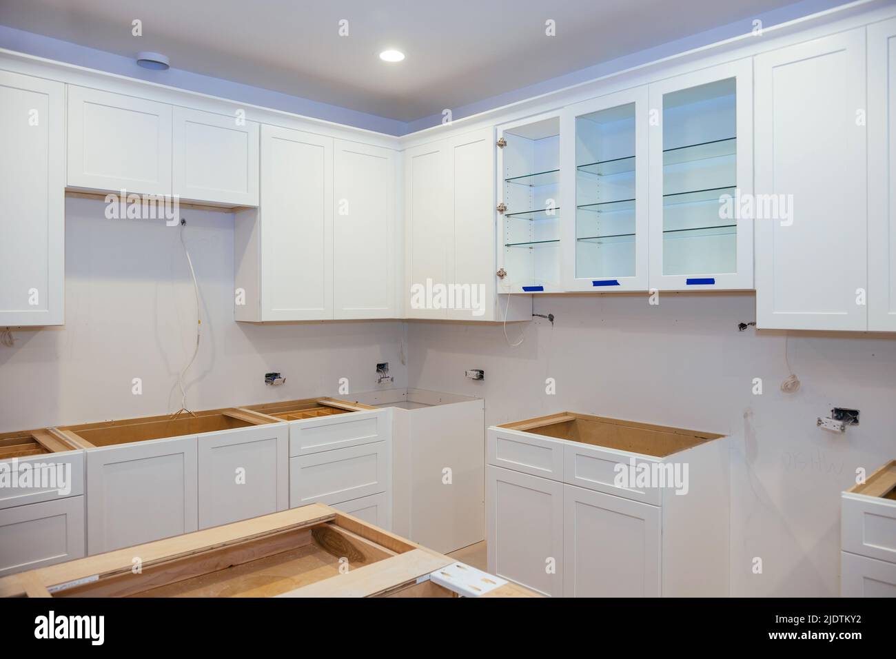 Assembly and installation of modern kitchen cabinets Stock Photo - Alamy