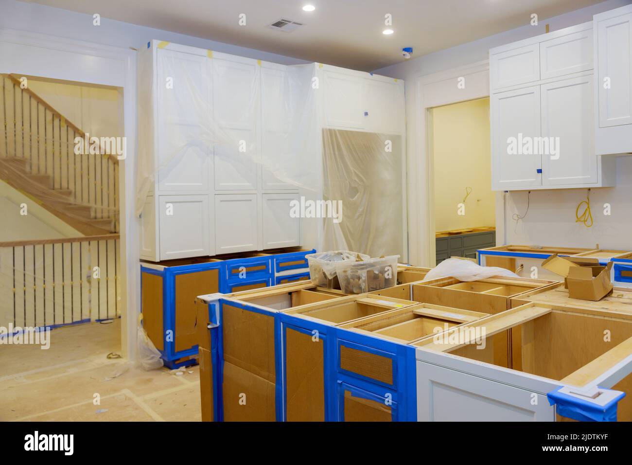 Assembling and installing modern kitchen cabinets Stock Photo - Alamy