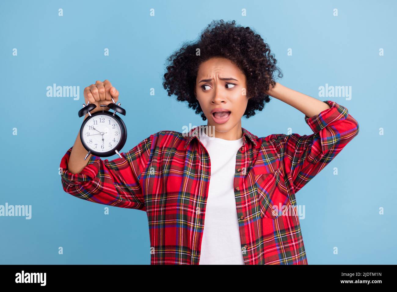 Photo of young black girl amazed shocked hand touch head clock timer ...