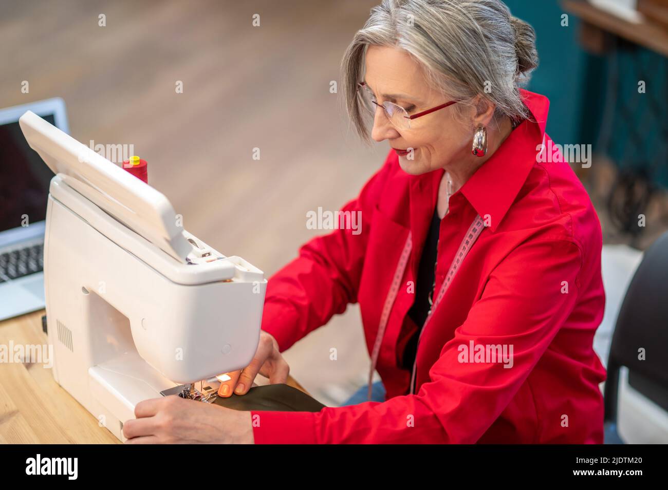 Top view of woman sewing on machine Stock Photo - Alamy