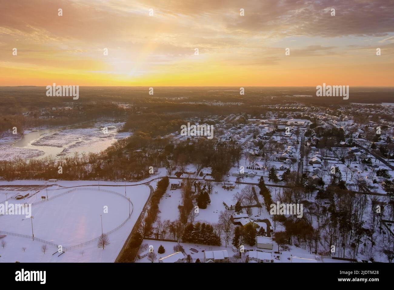 Stunning at sunset aerial view of American small town after snowfall ...