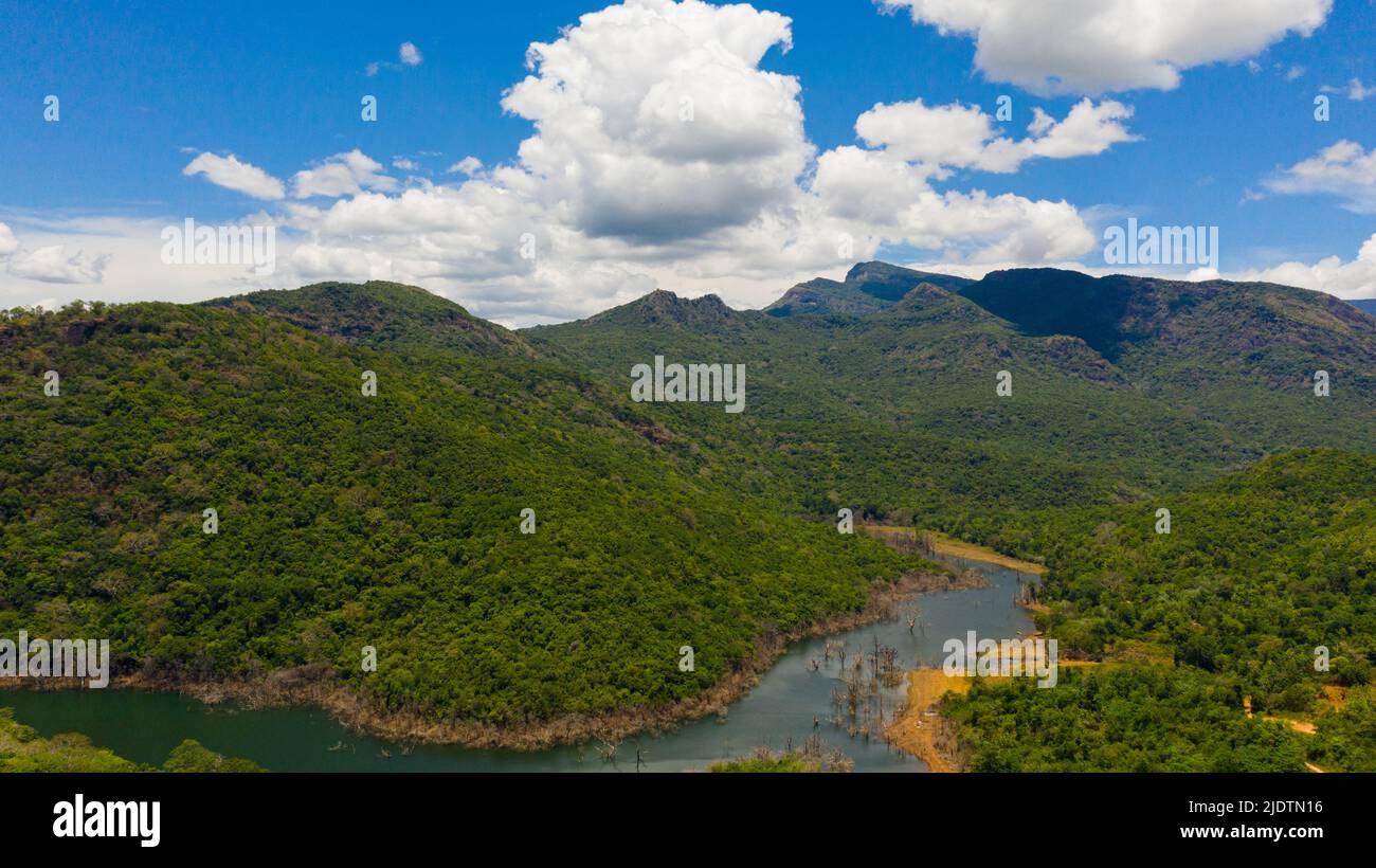Tropical landscape: mountains and jungle hills with lake. Kalu Ganga ...
