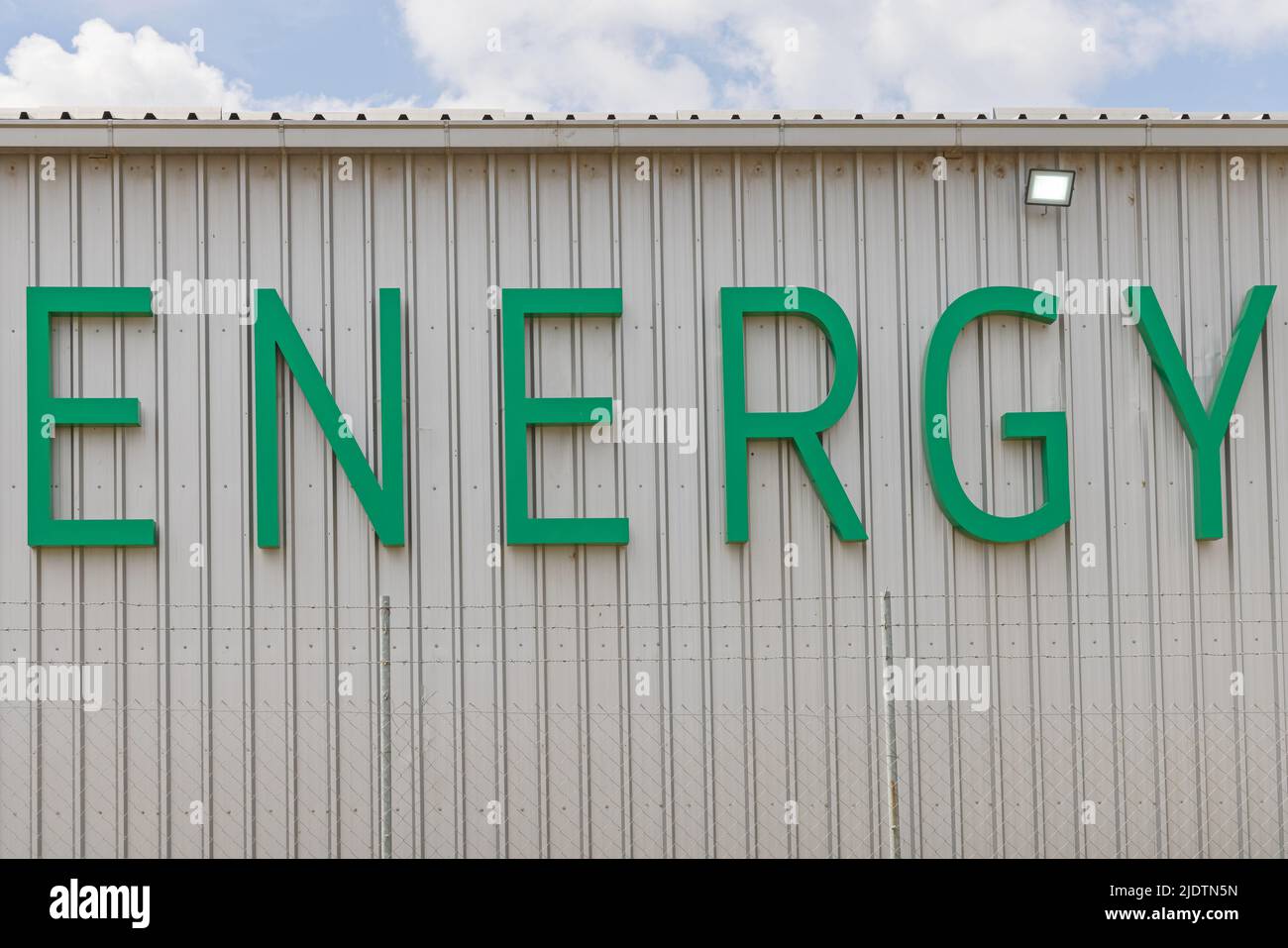 3d Green Sign Energy at Industrial Building Stock Photo - Alamy