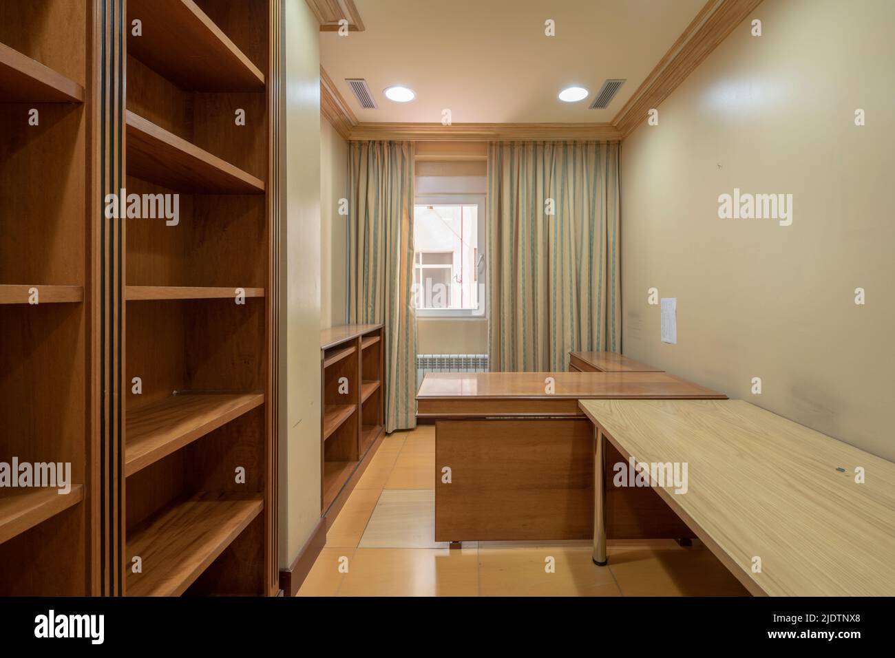 Professional office with tables for office workers and file area Stock ...