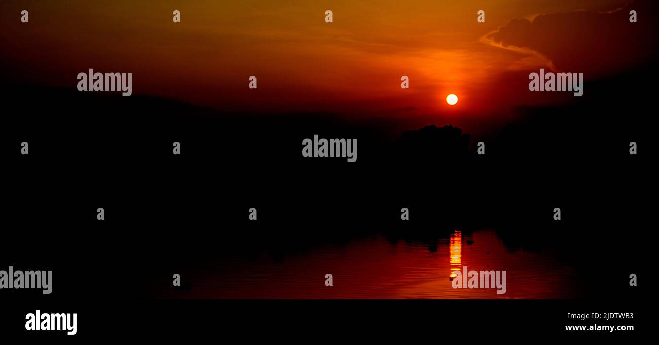 Sun rise and sun set background Stock Photo - Alamy