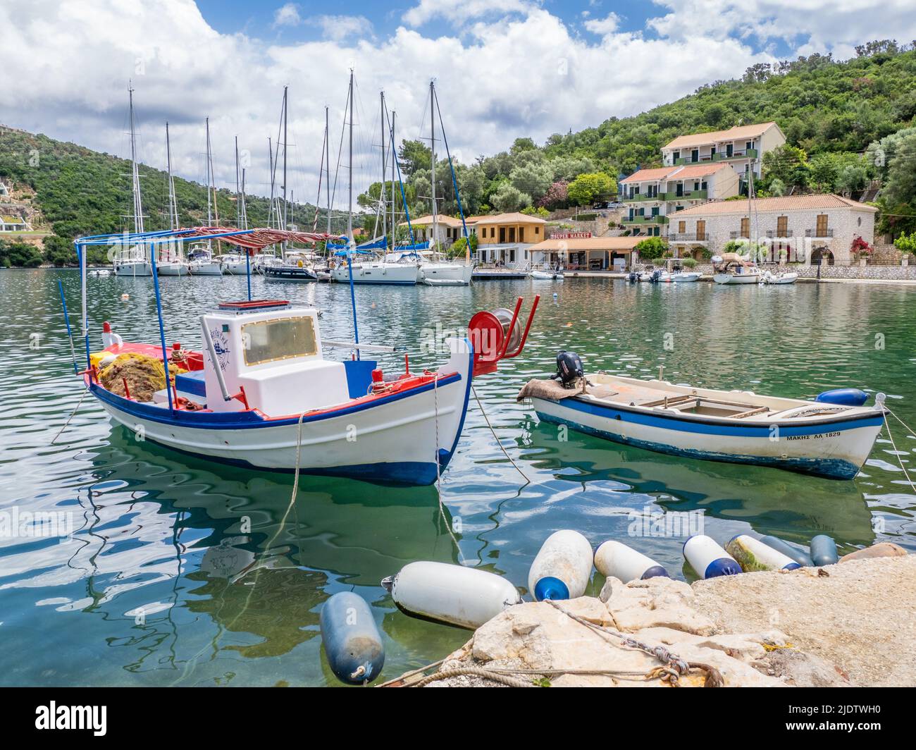 Boats in the pretty sheltered harbour at Sivota on the rugged south ...