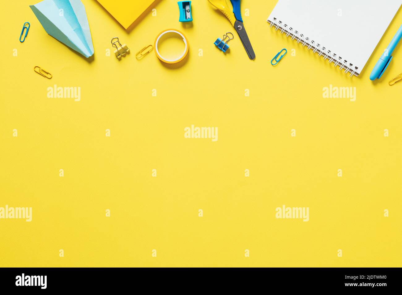 Frame border made of school supplies and stationery on yellow ...