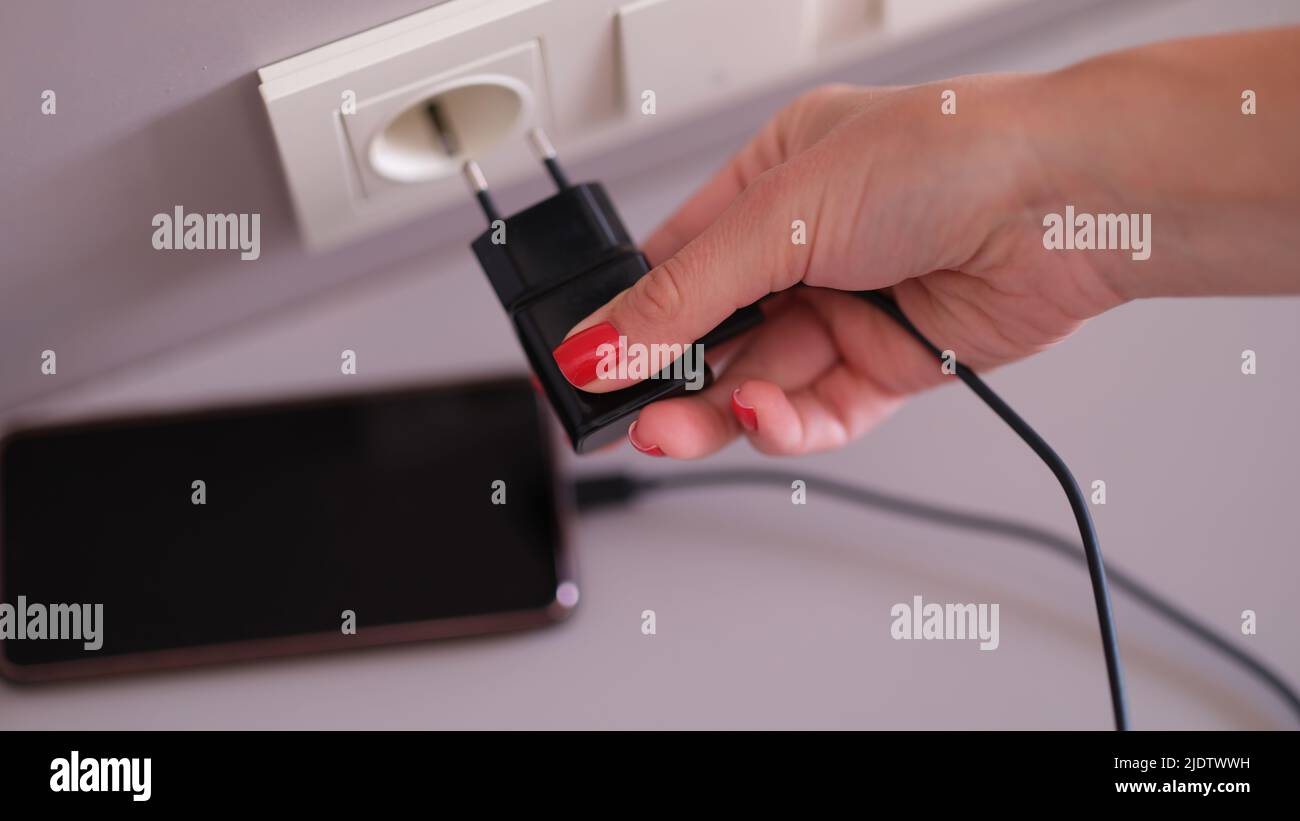 Woman hand plugging hi-res stock photography and images - Alamy