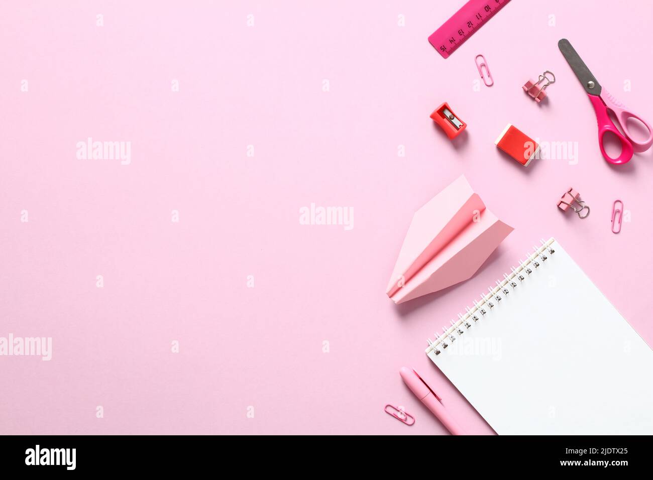 Flat lay pink school stationery and notepad on pink background. Back to ...