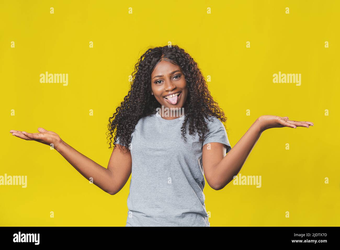 Beautiful african american girl with dark hair smiles happily and ...