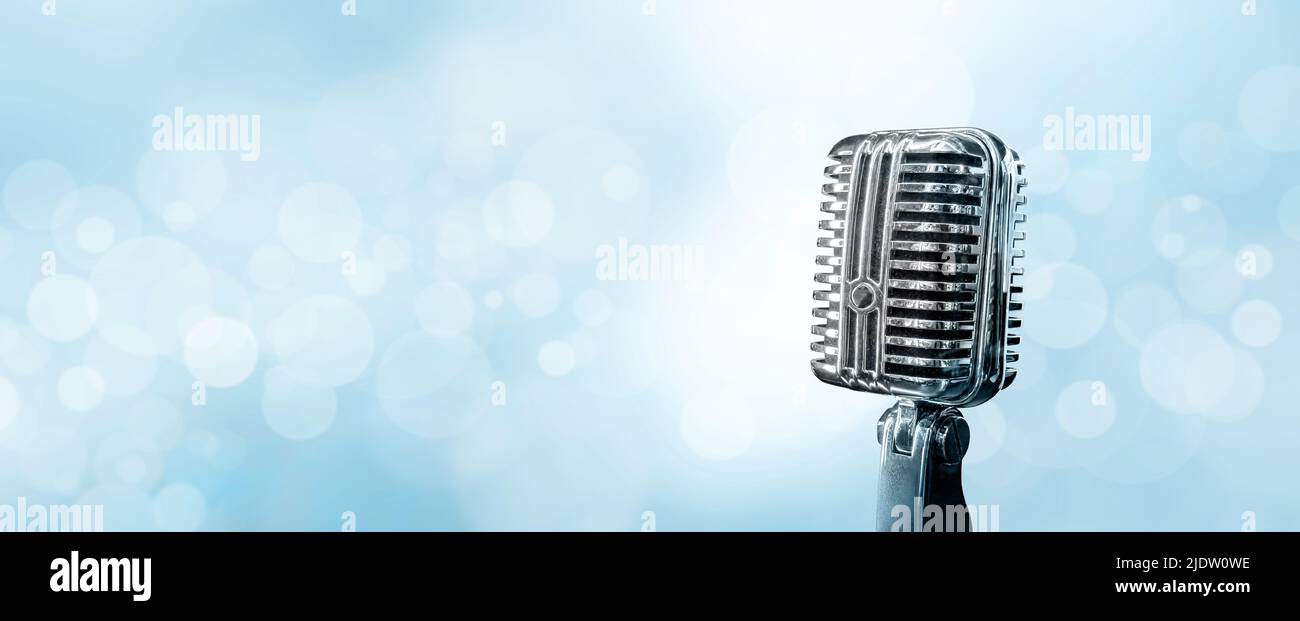 Retro microphone on blue color background with copy space Stock Photo ...