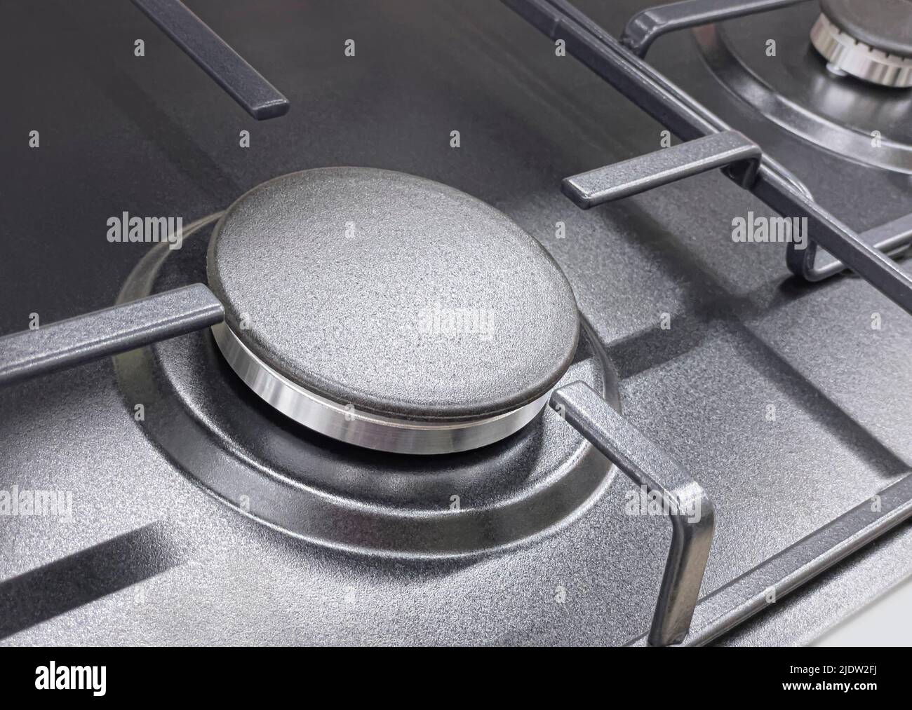 black metal kitchen stove close up in home kitchen. background gas ...