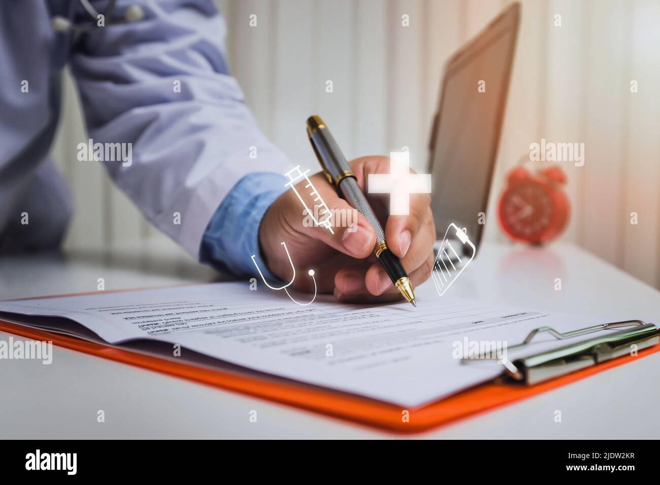 Doctor in gown uniform using a pen write on medical chart Stock Photo ...
