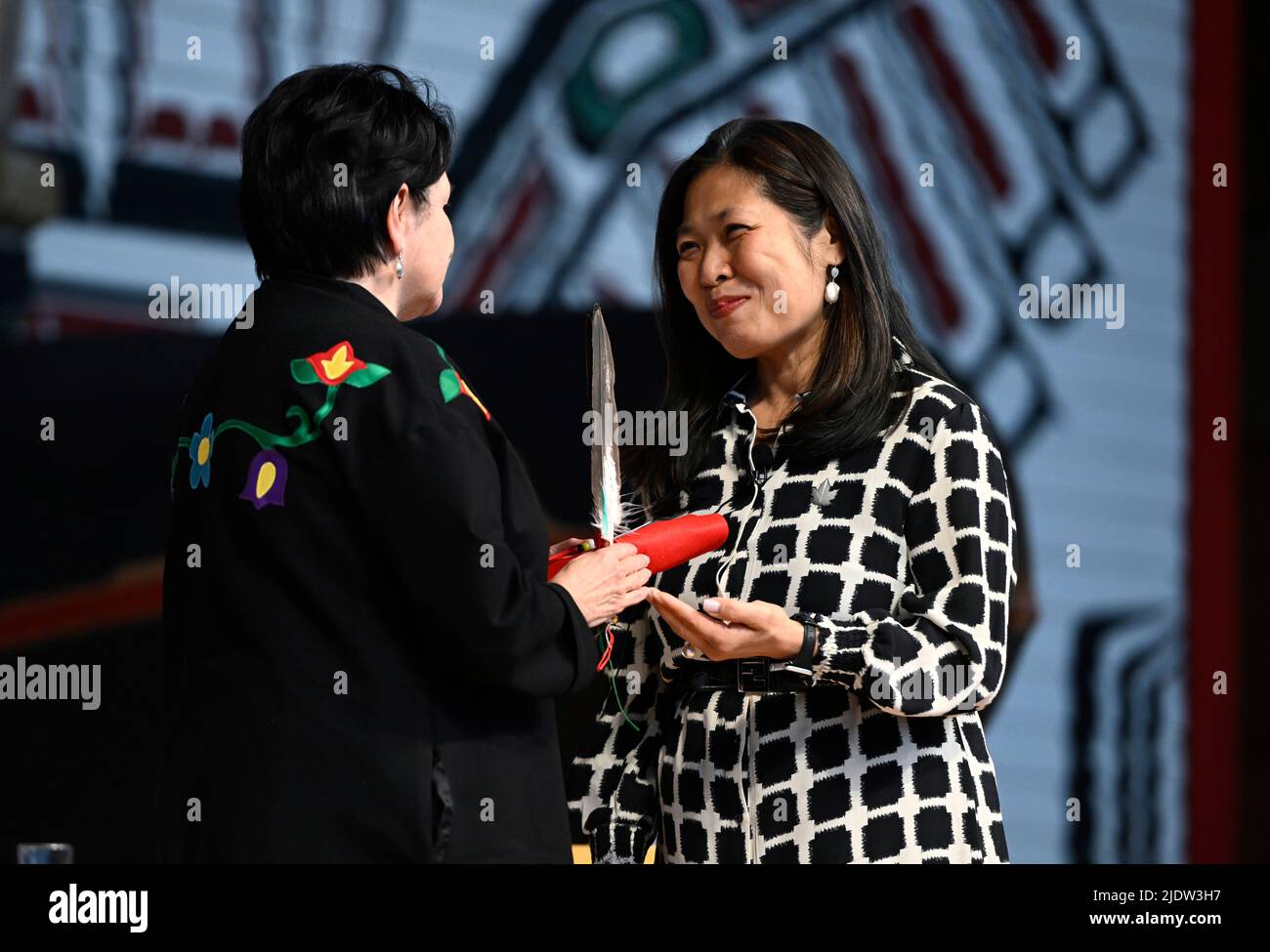 Minister of Economic Development Mary Ng gives a gift of tobacco to ...