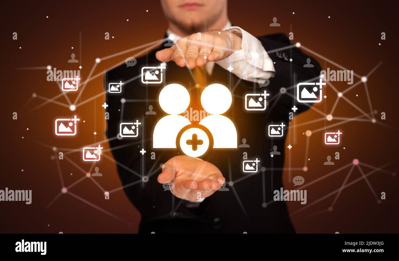 Hand holding social media icons Stock Photo - Alamy