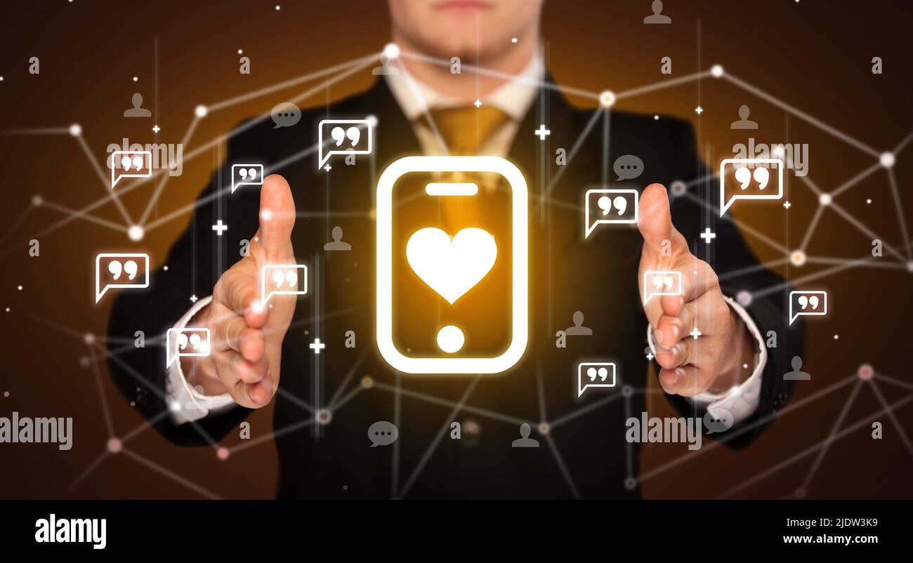 Hand holding social media icons Stock Photo - Alamy