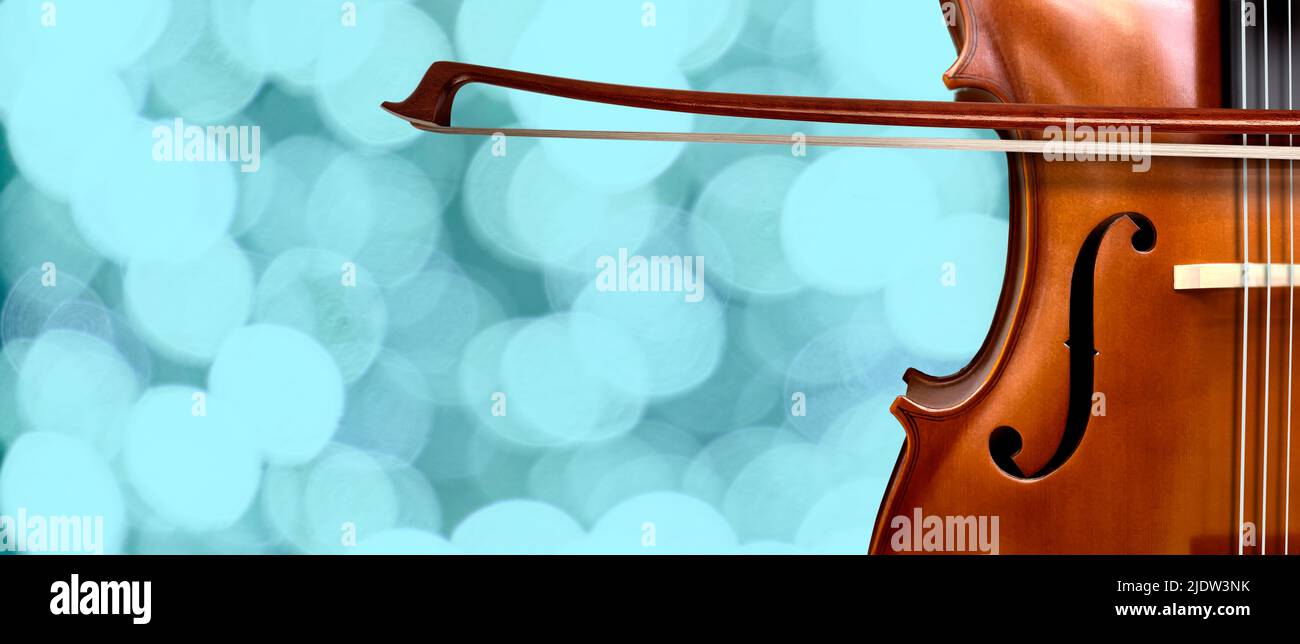 Violin on a bokeh lights background close up Ancient stringed ...
