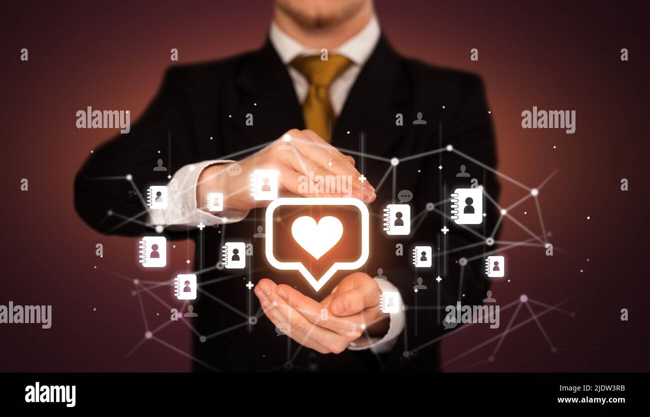 Hand holding social media icons Stock Photo - Alamy