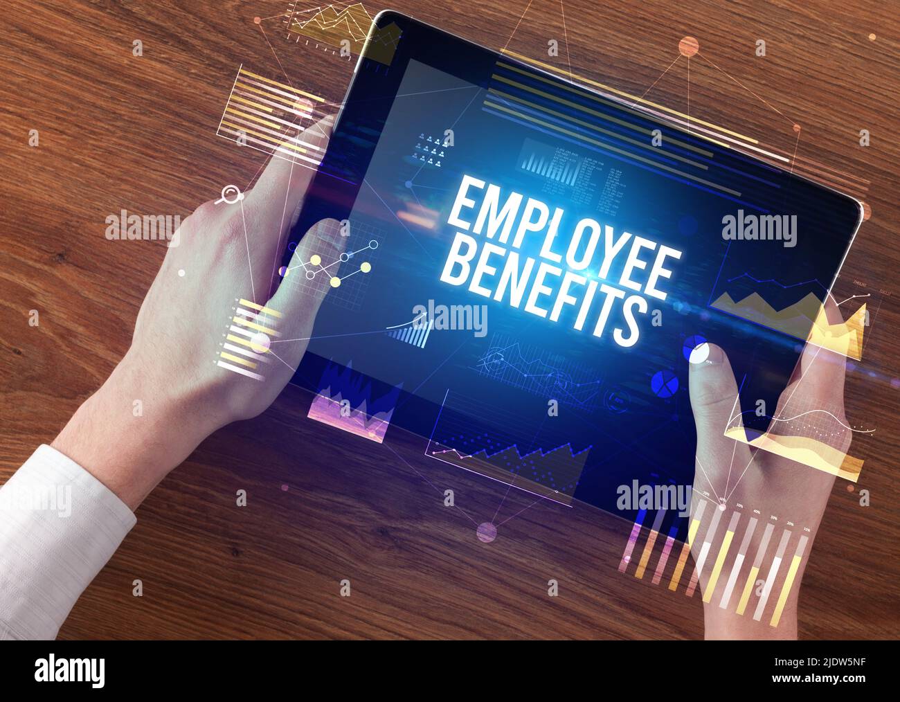 Close-up of hands holding tablet with business inscription Stock Photo ...