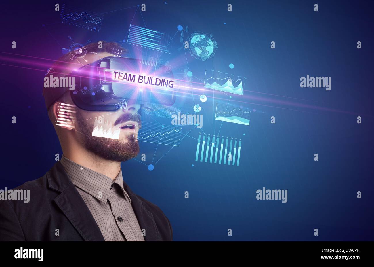 Businessman looking through Virtual Reality glasses Stock Photo - Alamy
