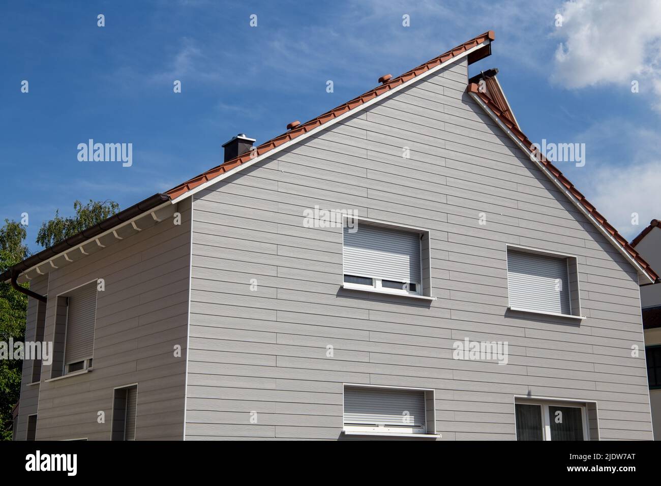 Residential home with facade cladding Stock Photo - Alamy