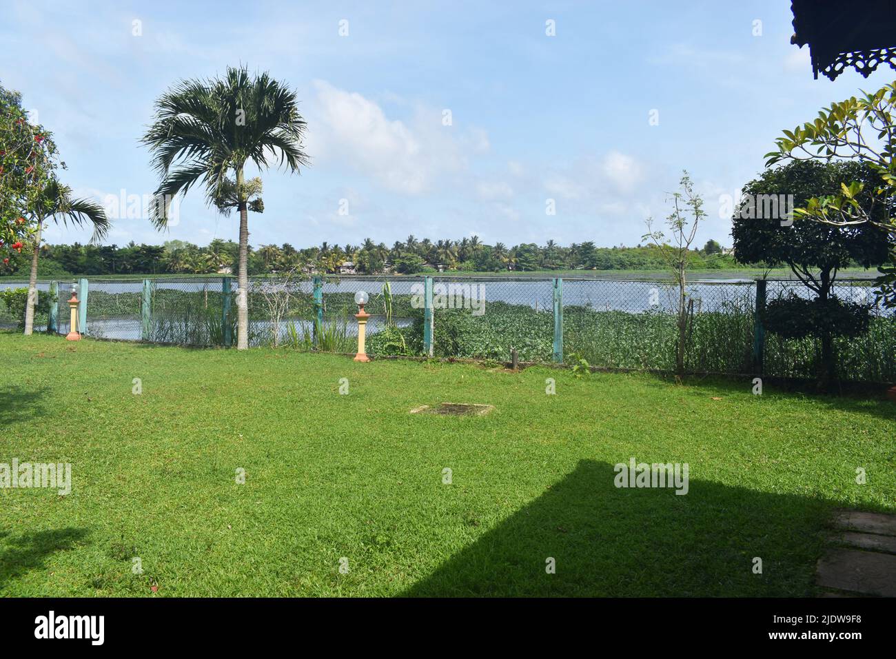 A landscape garden with a view of the Bolgoda Lake. The Bolgoda Lake or ...