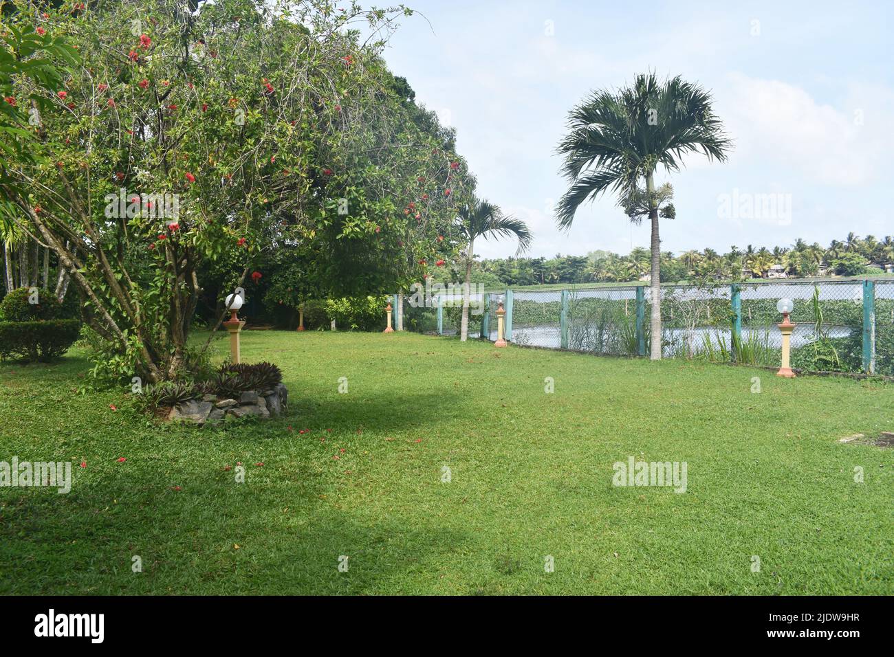 A landscape garden with a view of the Bolgoda Lake. The Bolgoda Lake or ...