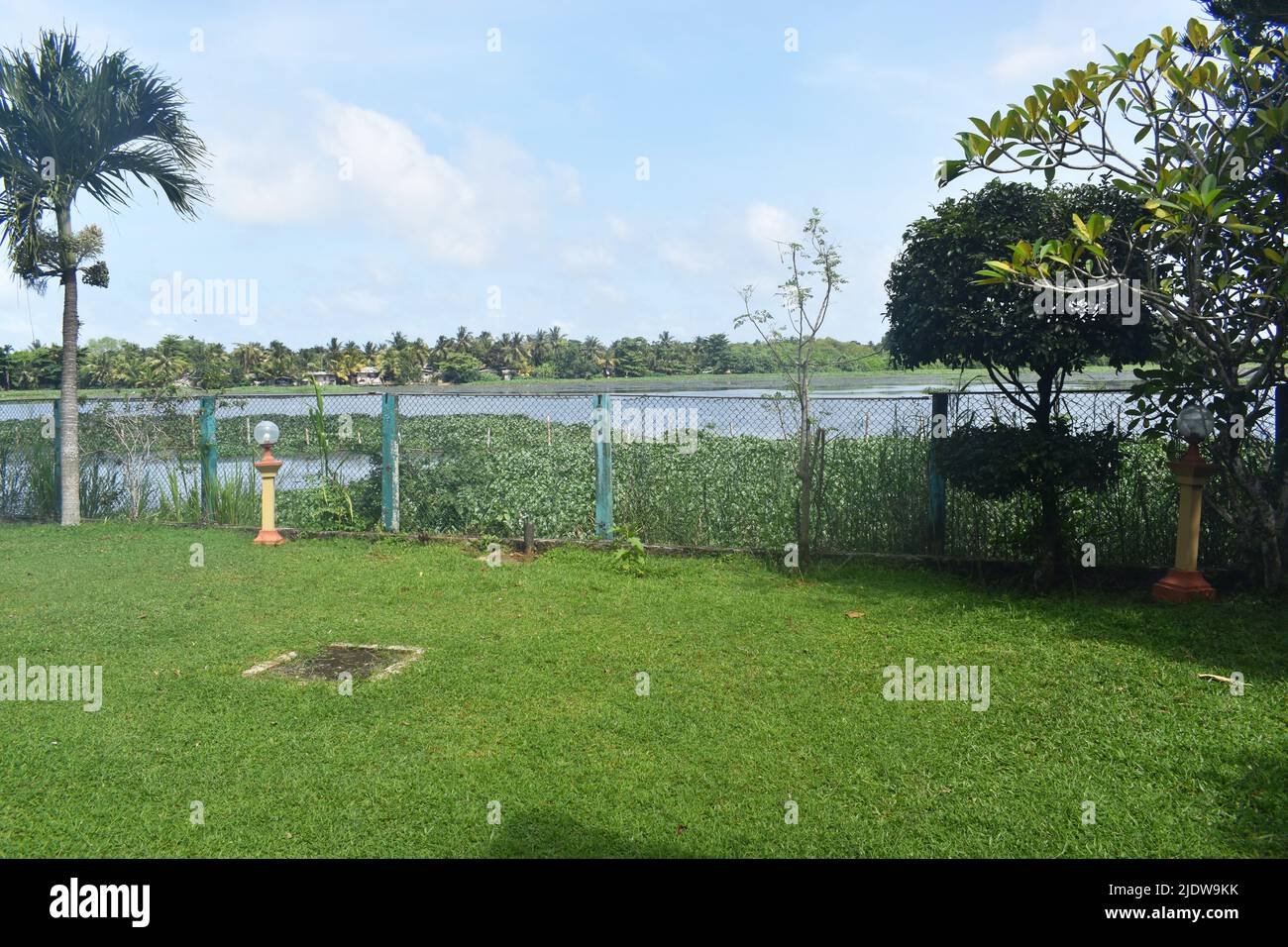 A landscape garden with a view of the Bolgoda Lake. The Bolgoda Lake or ...