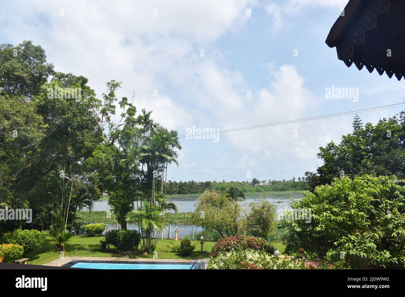 A landscape garden with a view of the Bolgoda Lake. The Bolgoda Lake or ...