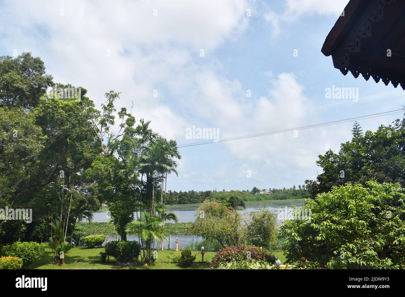 A landscape garden with a view of the Bolgoda Lake. The Bolgoda Lake or ...