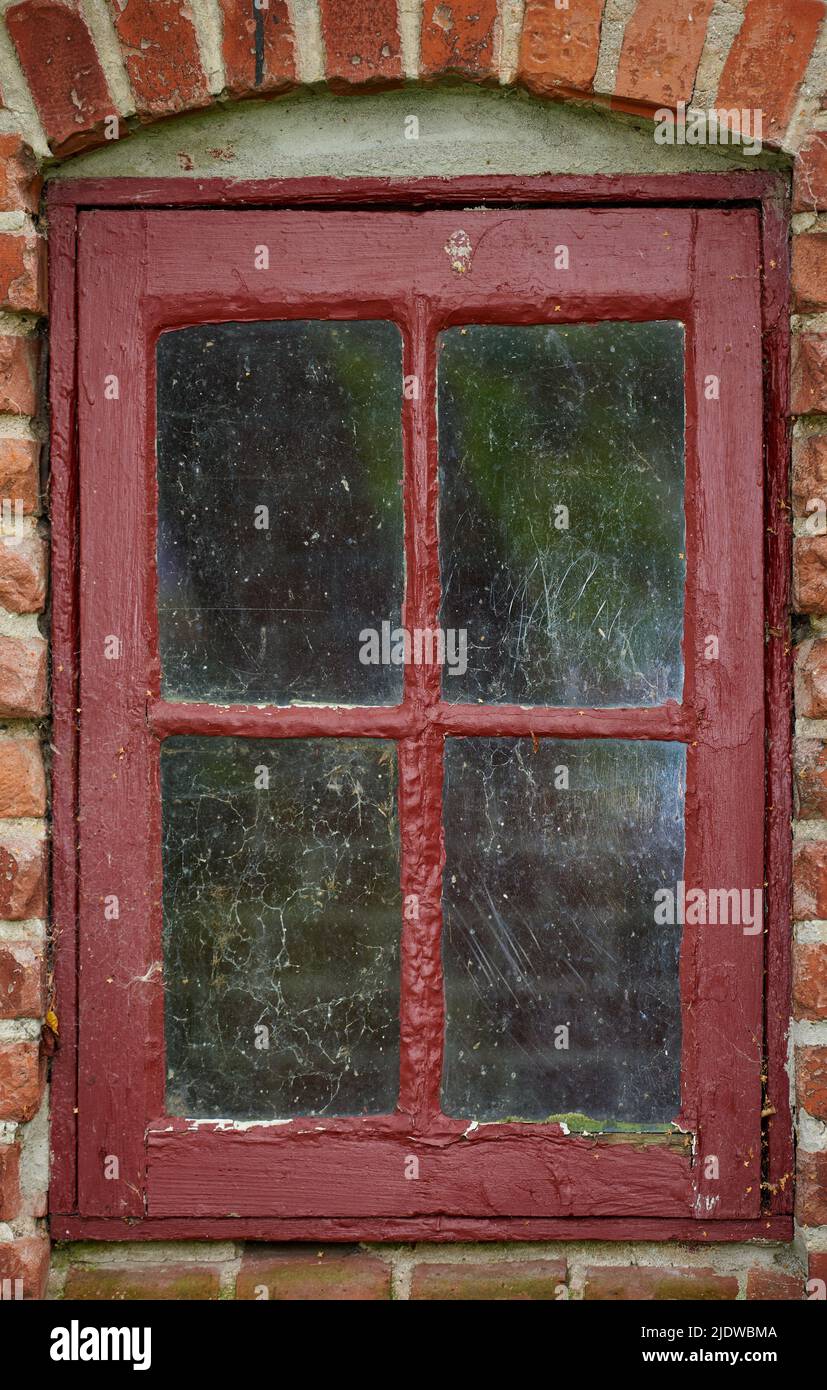 Old dirty window of a brick wall house or home. Ancient casement with ...