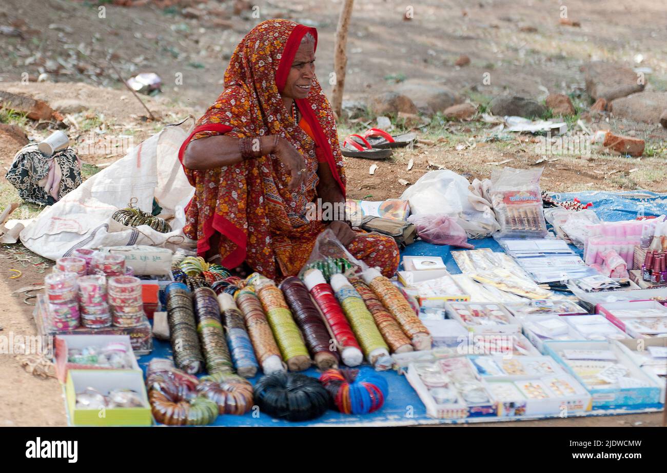 Woman selling various things along the road close to Shanpura, Madhya ...
