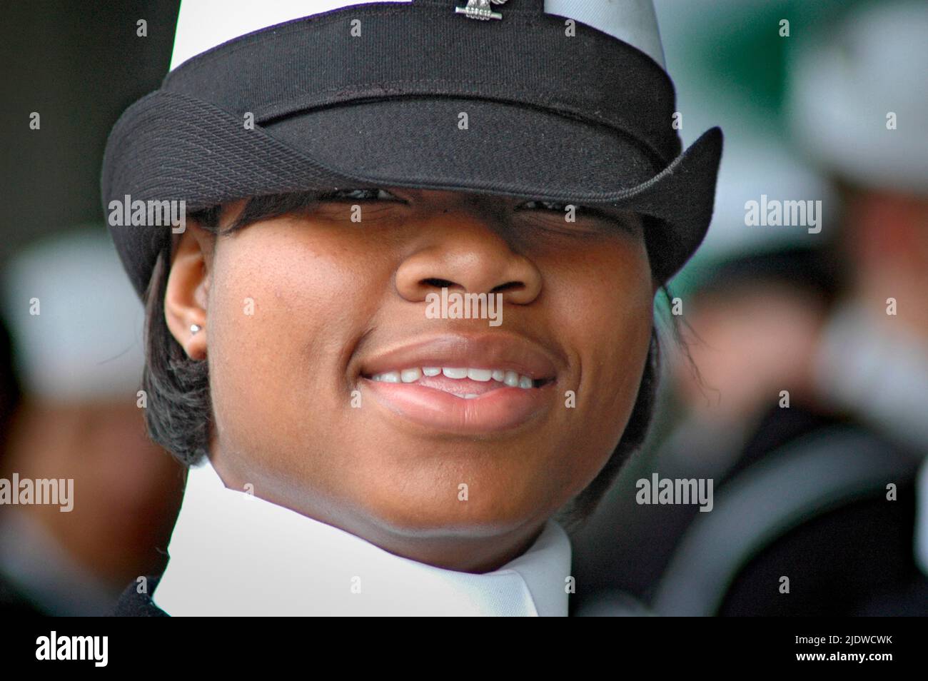 Young men and women high schoolers in the Navy Jr.ROTC about to march ...