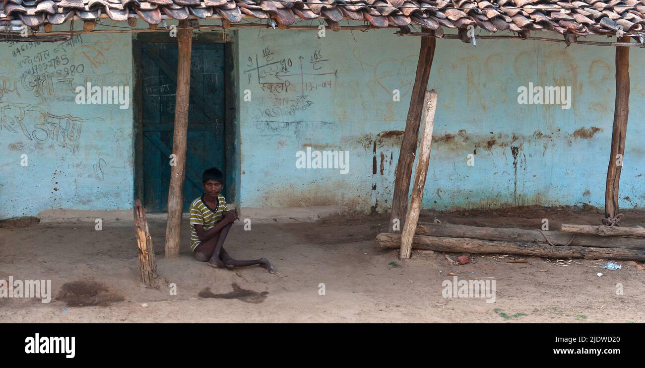A handicapped boy outside his house close to Tamnara, Madhya Pradesh ...